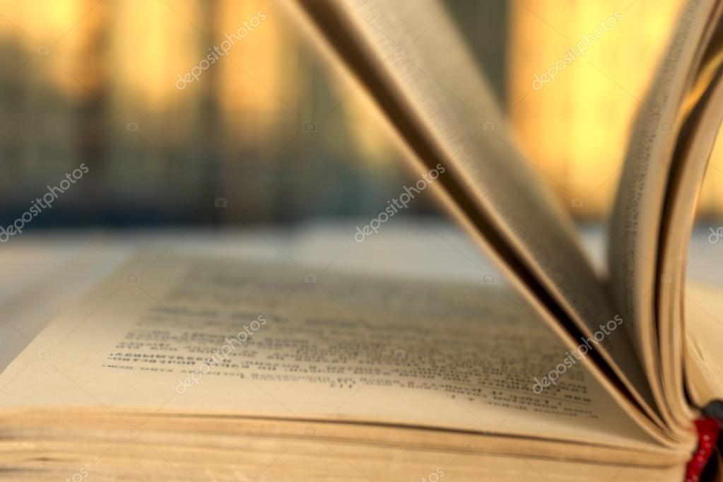 Open book on wood planks over abstract light background Stock Photo by ...