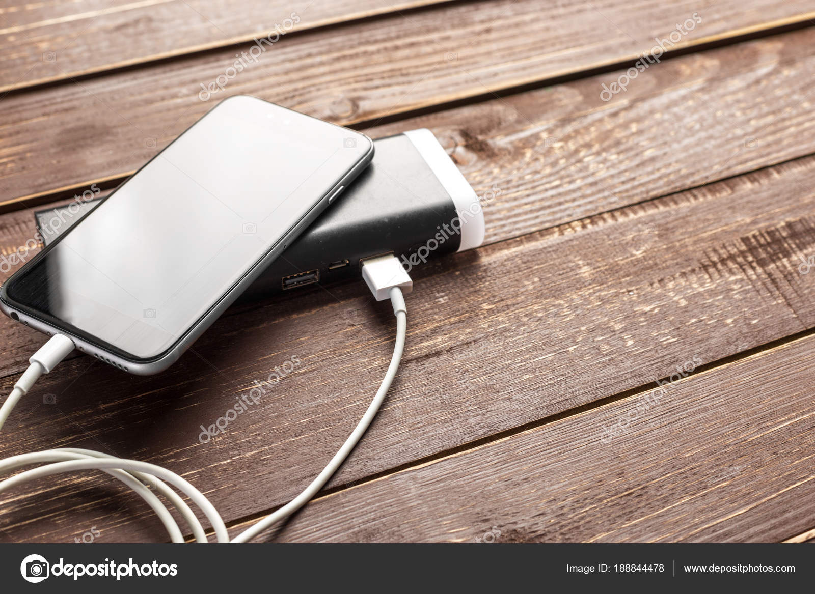 Smartphone Charging Power Bank Table Background Stock Photo by ...