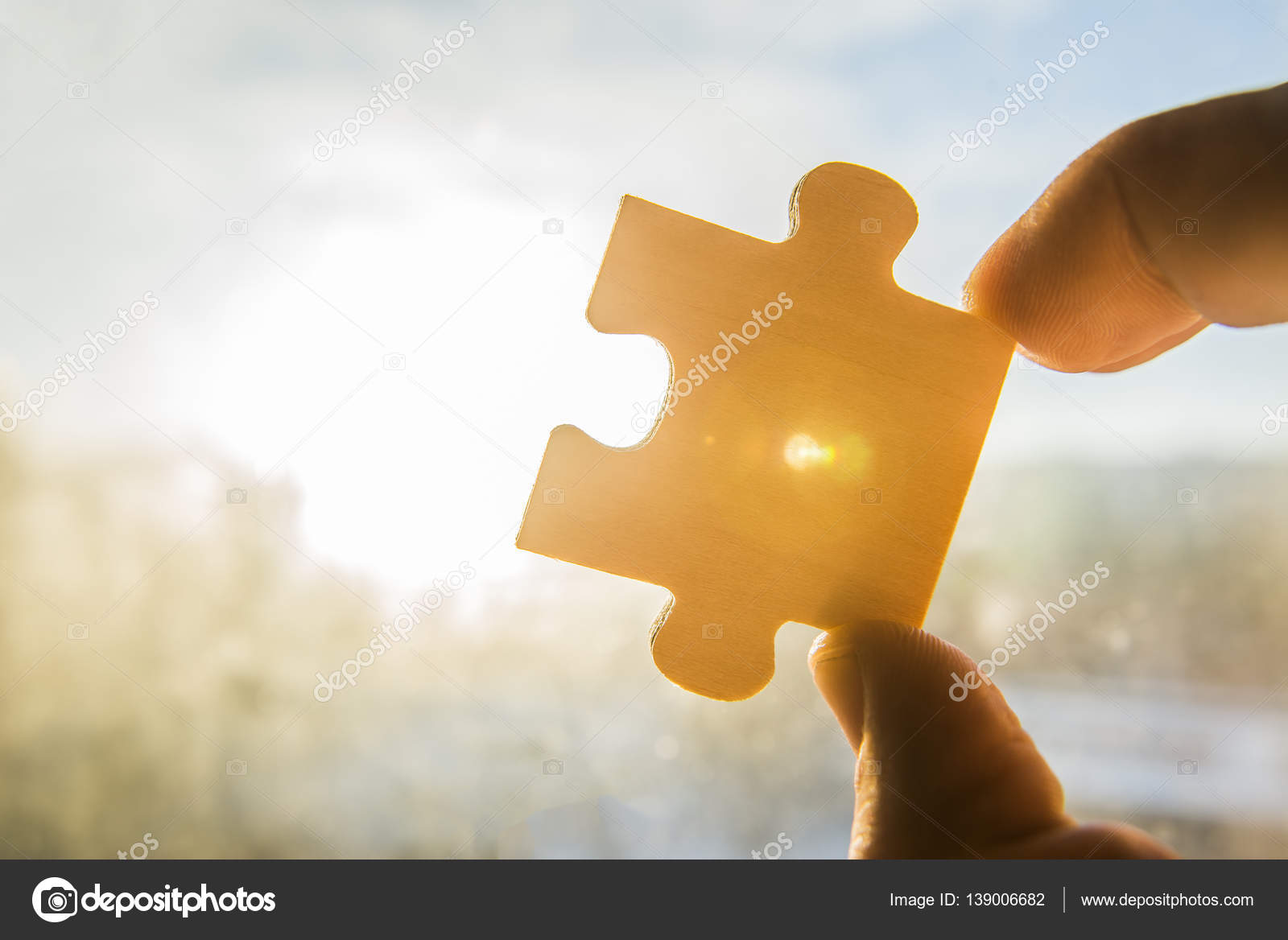 Hand trying to connect puzzle piece Stock Photo by ©borjomi88 139006682