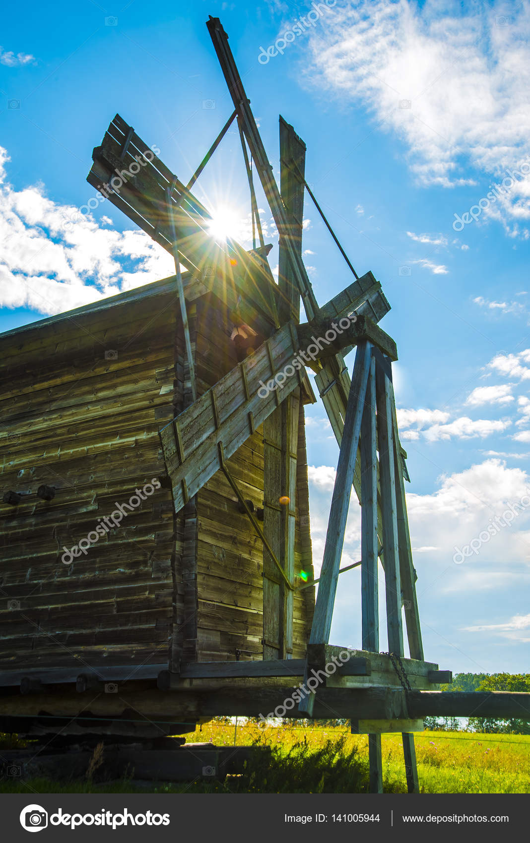 Old wind mill on blue sky with clouds background. Vintage, retr — Stock ...