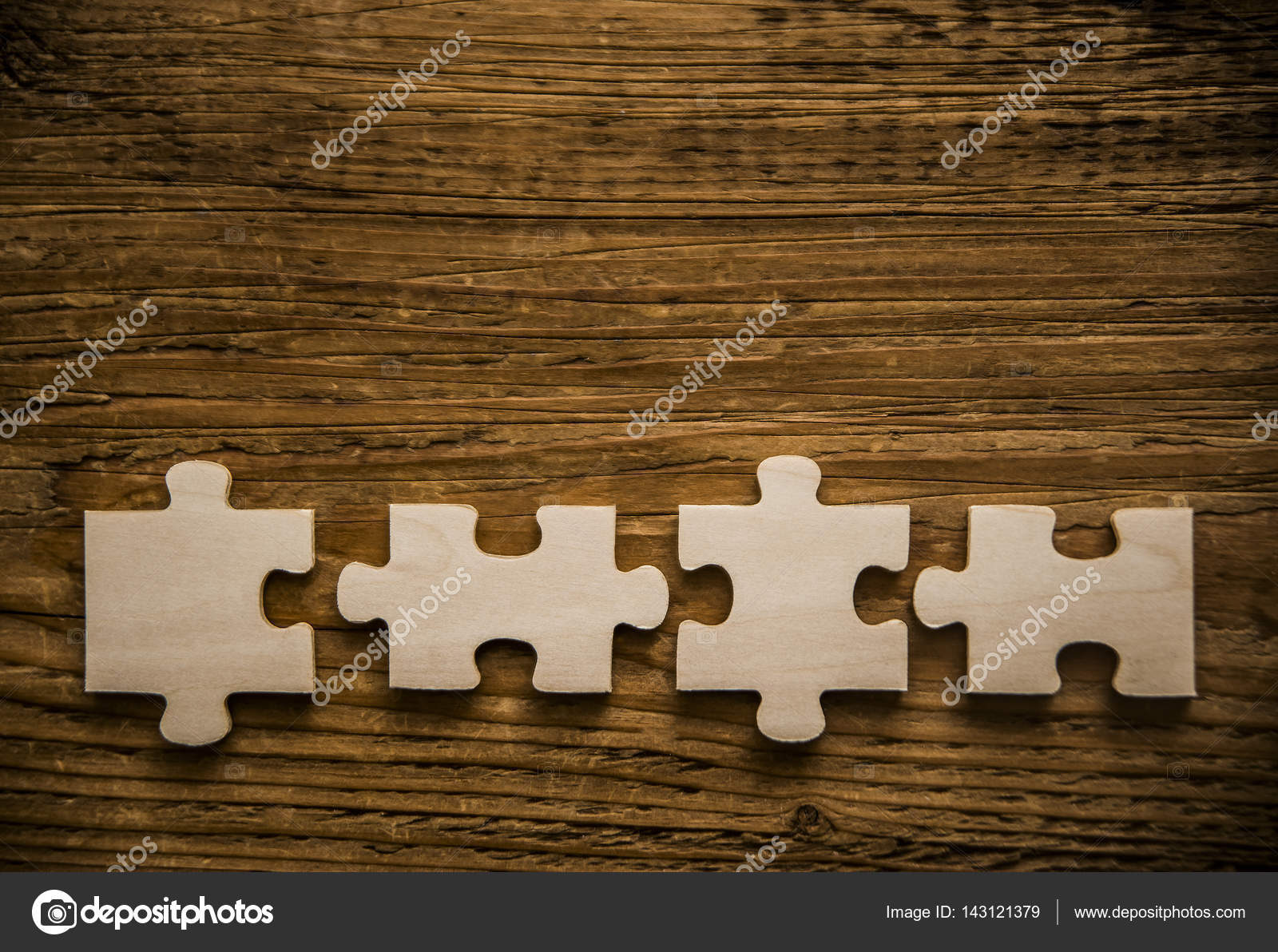 Four brown pieces of puzzle Stock Photo by ©borjomi88 143121379