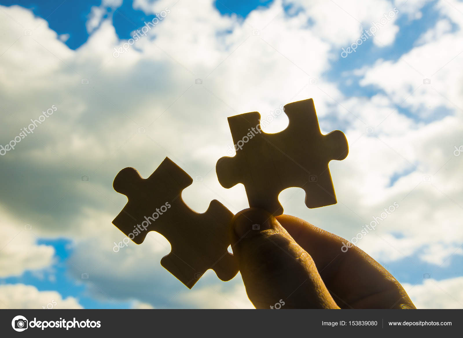 Hand holding puzzle pieces — Stock Photo © borjomi88 #153839080 Hand holding puzzle pieces — Stock Photo © borjomi88 #153839080