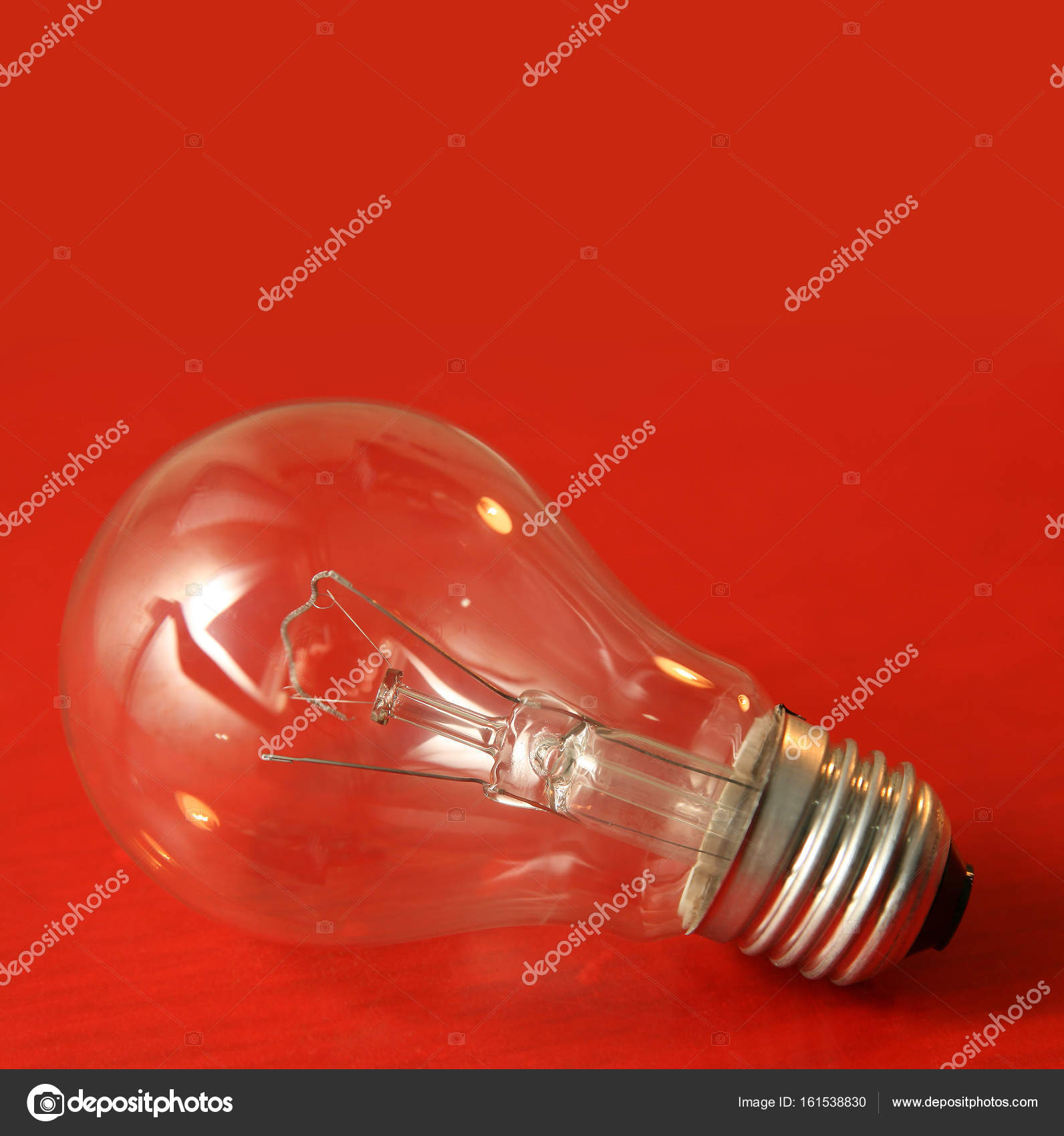 Bulb on red texture background. Stock Photo by ©borjomi88 161538830