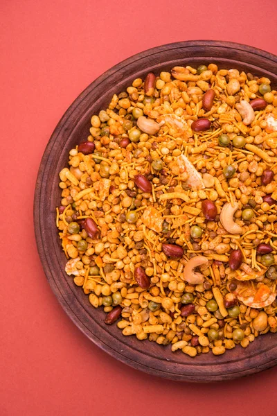 Indian famous snack called Farsan or chivada or chakna with hot tea ...