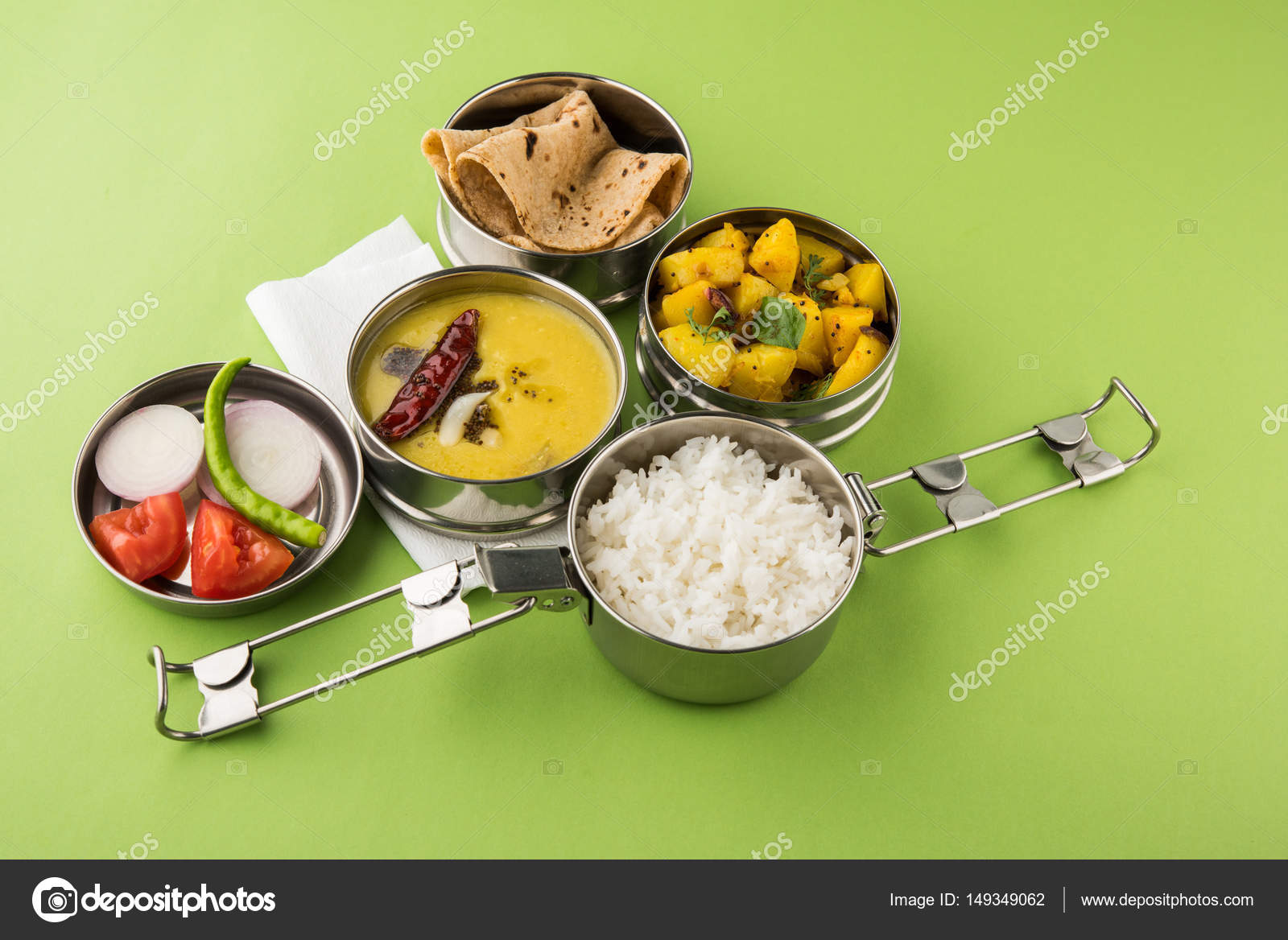 Indian typical stainless steel lunch box or tiffin with north indian or ...