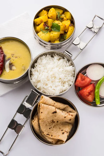 Indian typical stainless steel lunch box or tiffin with north indian or ...