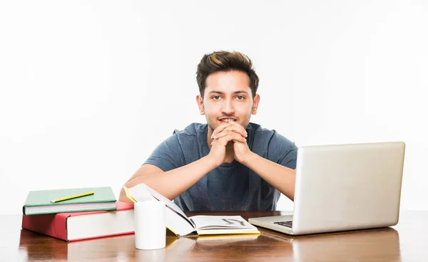 Handsome and young indian Male college student carrying bag on white ...