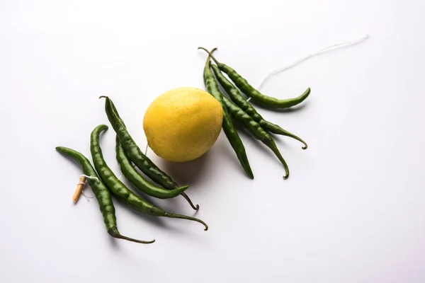 Lemon Chilies Hanging Indian Superstitious Lemon Green Chillies Tied ...