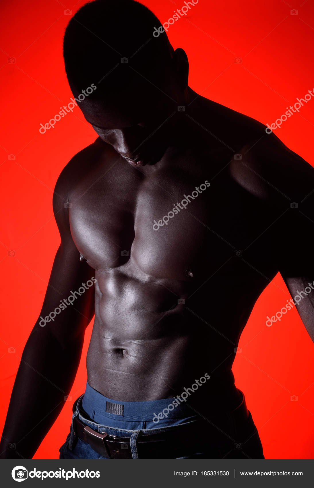 Torso of an african man on red background Stock Photo by ©MariaiC 185331530
