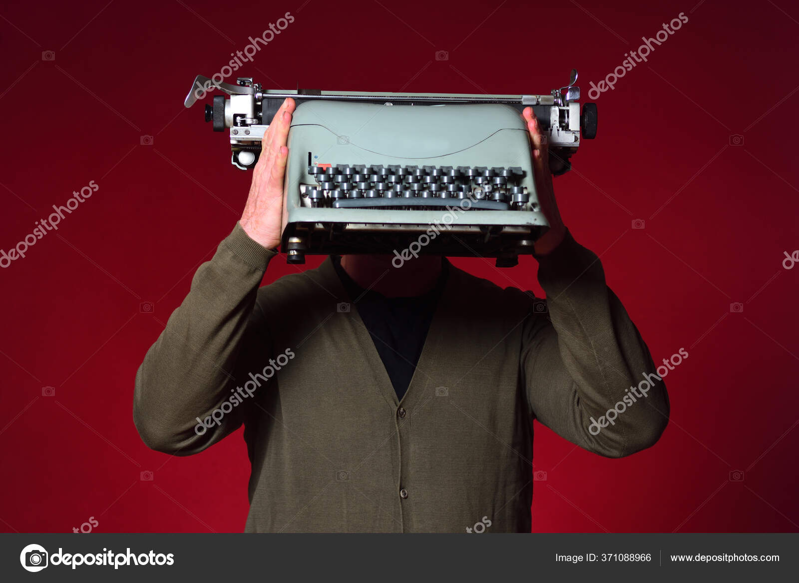 Man Holding Typewriter Red Background Stock Photo by ©MariaiC 371088966