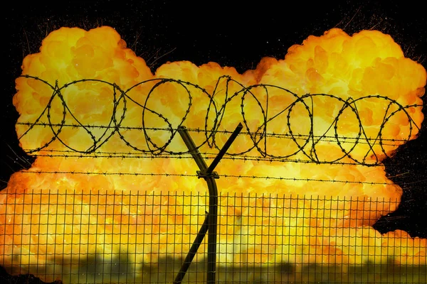 Realistic orange fire explosion behind restricted area barbed wire ...