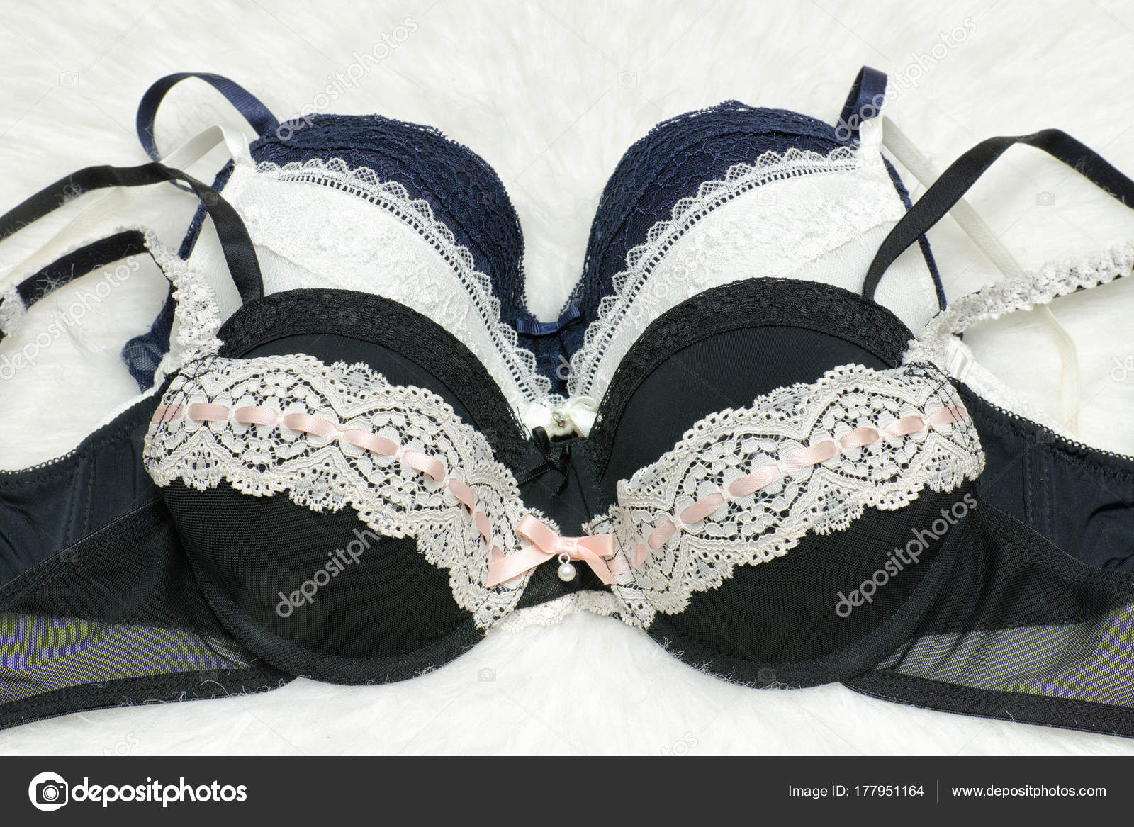 Four lace bra on white fur. Fashionable concept — Stock Photo ...