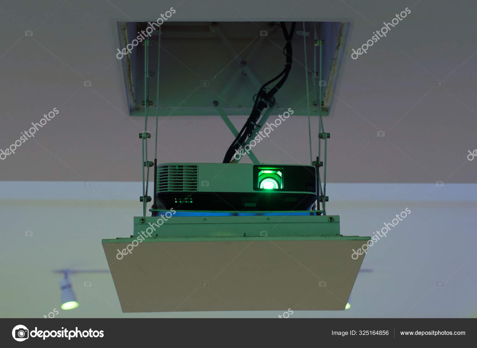 Projector installed on the ceiling of hotel conference room. Stock ...