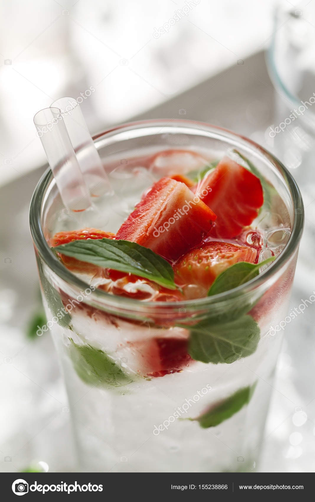 Tasty fresh cold drink with ice, water, mint and strawberry — Stock ...
