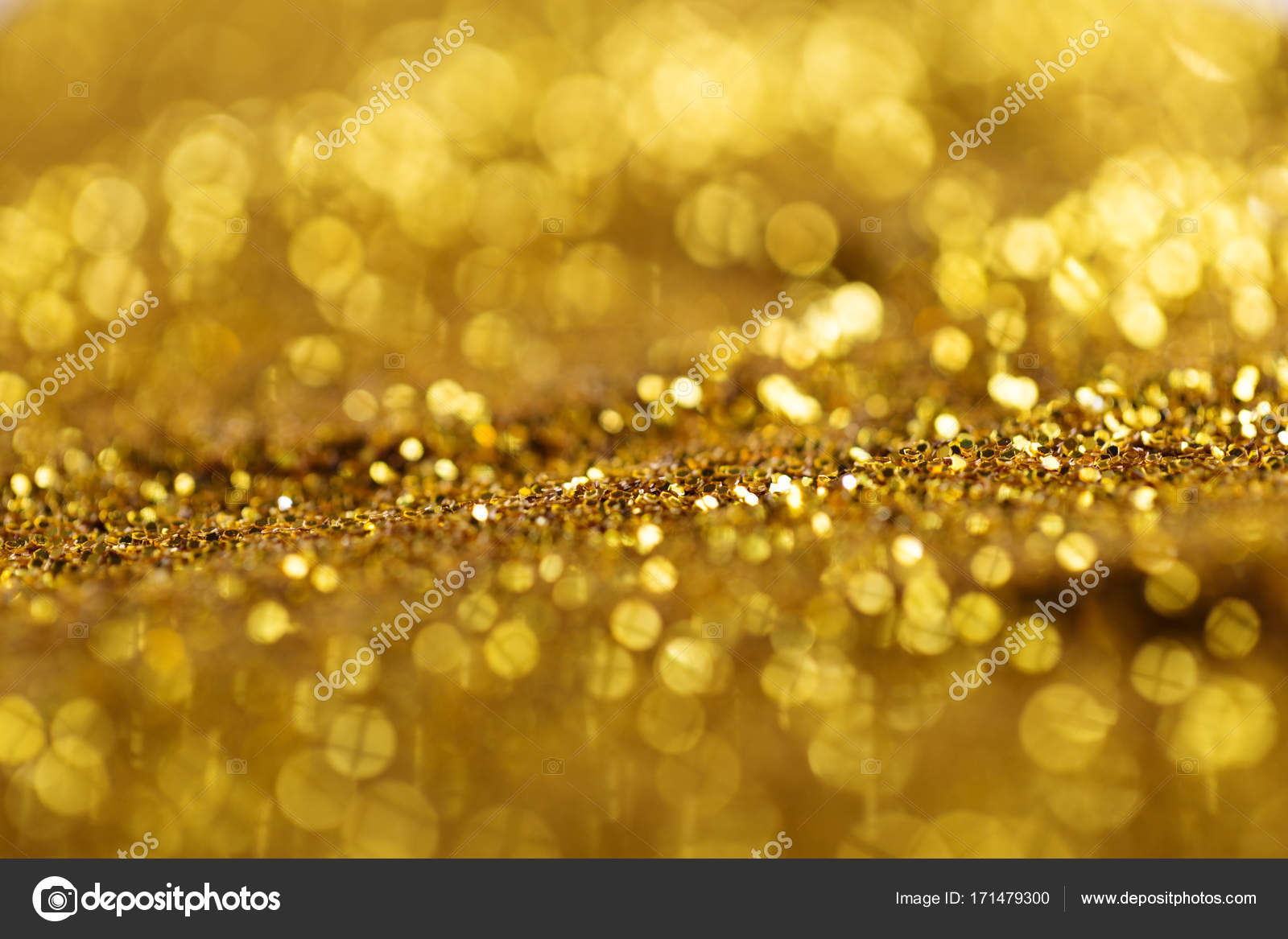 Glowing gold sparkles in light Stock Photo by ©nerudol 171479300