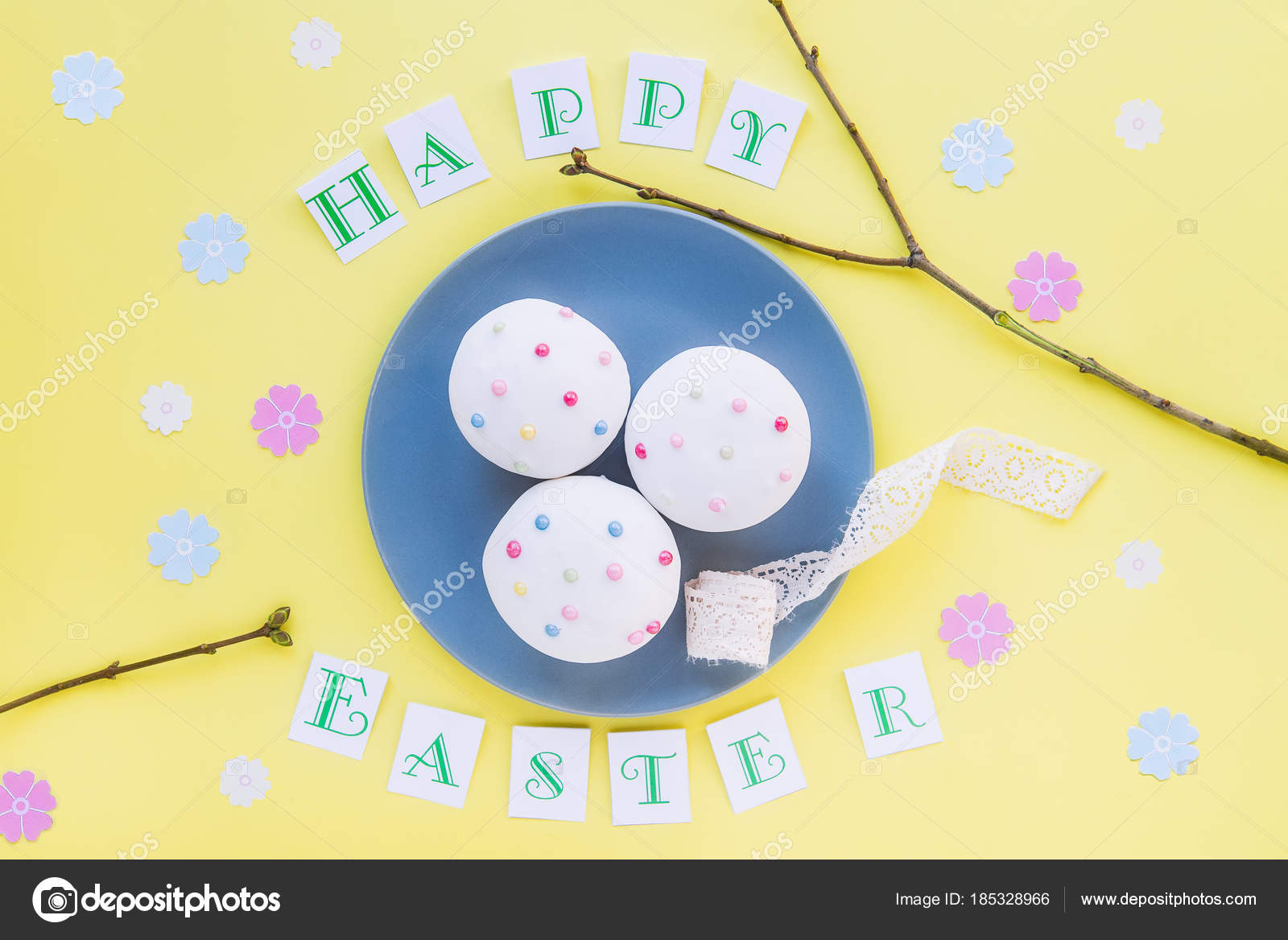 Top view composition with plate with cupcakes, Happy Easter lettering ...