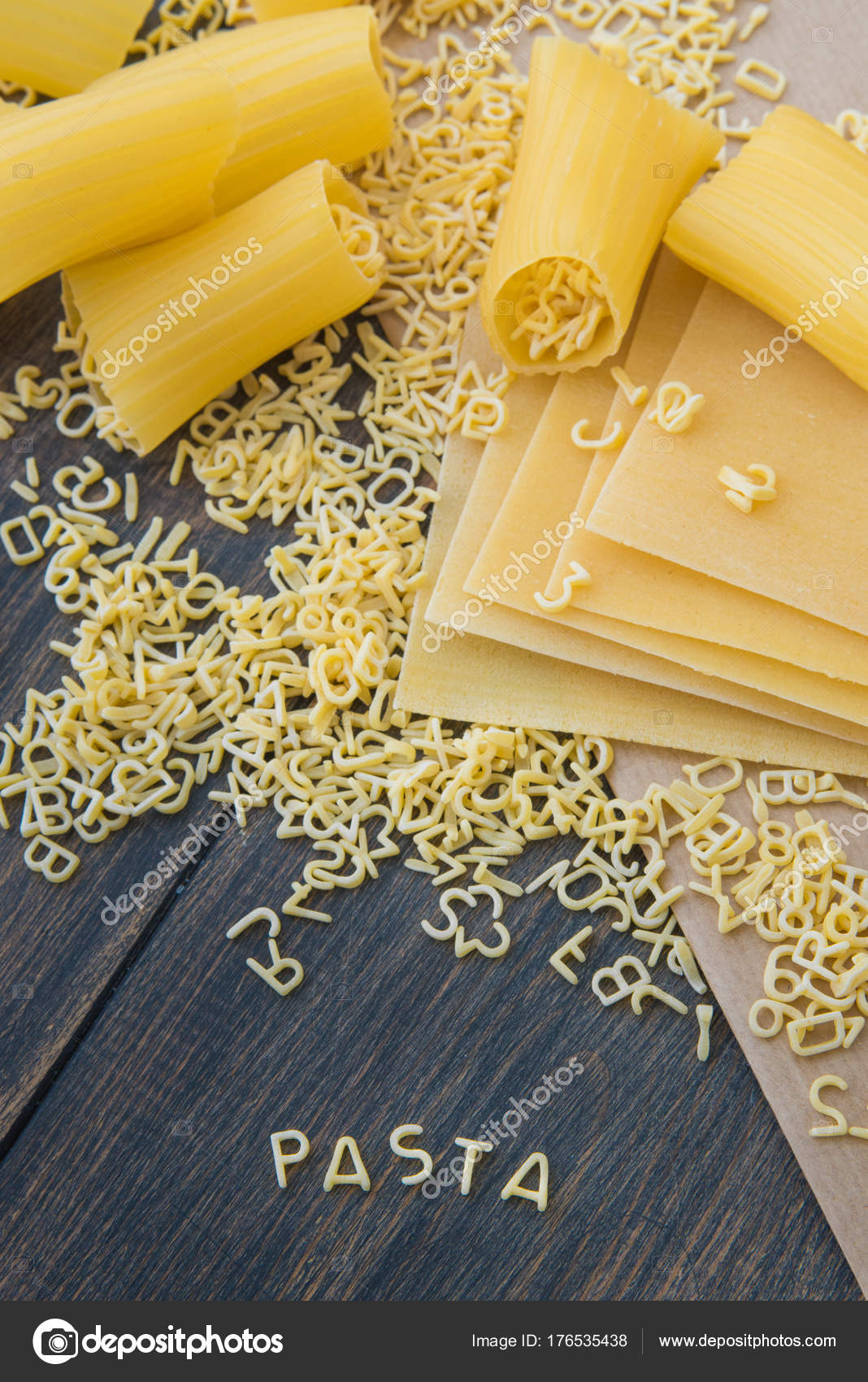 Uncooked raw pasta alphabet yellow letters with macaroni and lasagna ⬇ ...