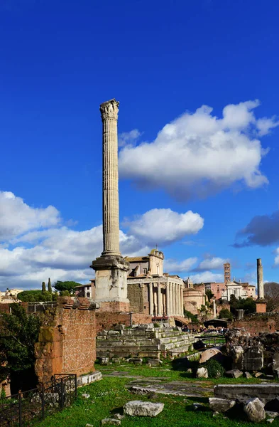 Tourists visiting the Column of Phocas at the Roman Forum in Rome ...
