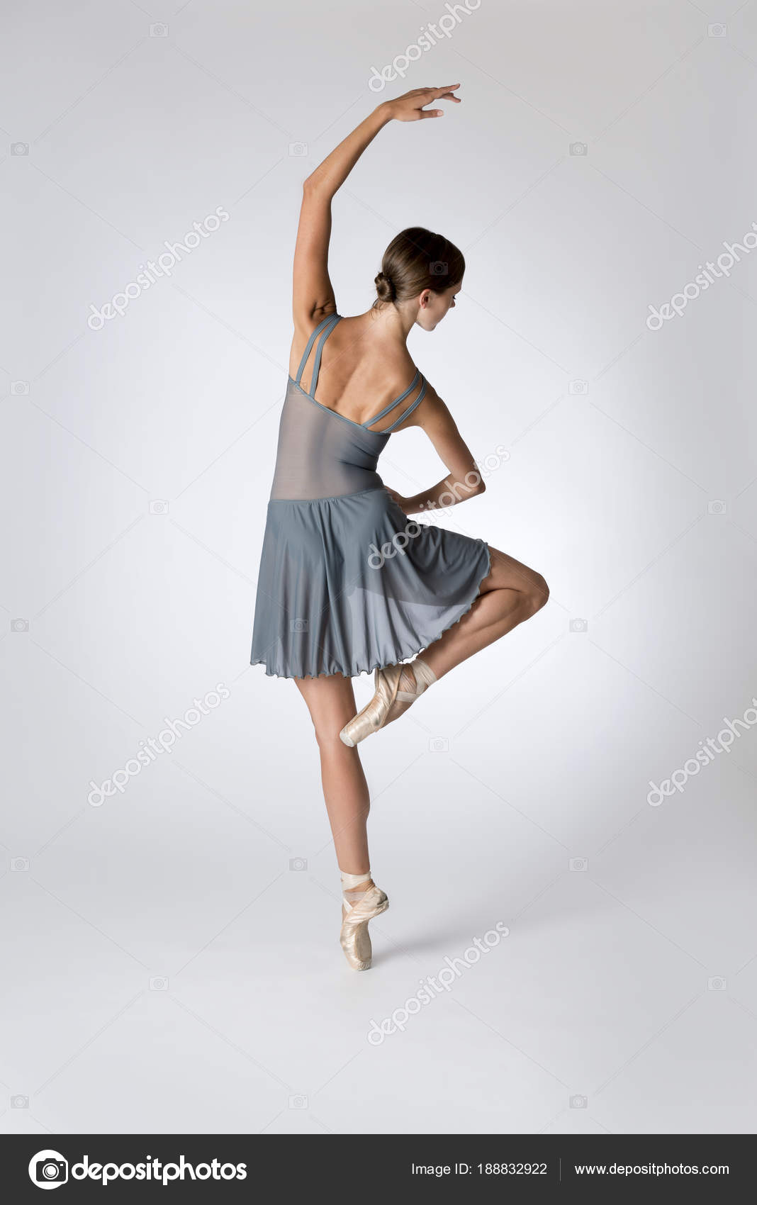 Back View of Ballerina Dancing on a Gray Backgroiund Stock Photo by ...
