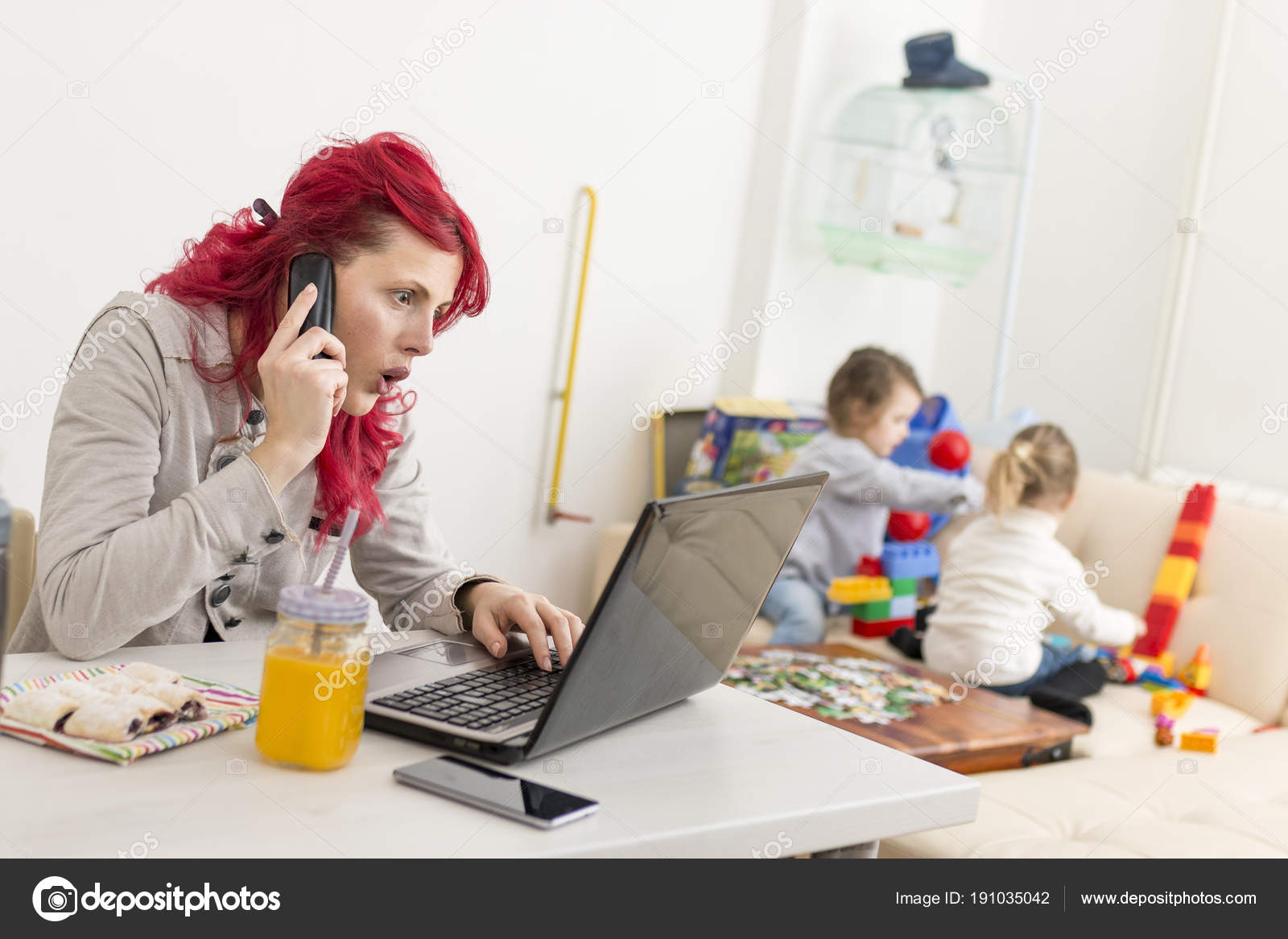 Busy Mom Talking on Phone Working as Kids Play in Background ⬇ Stock ...