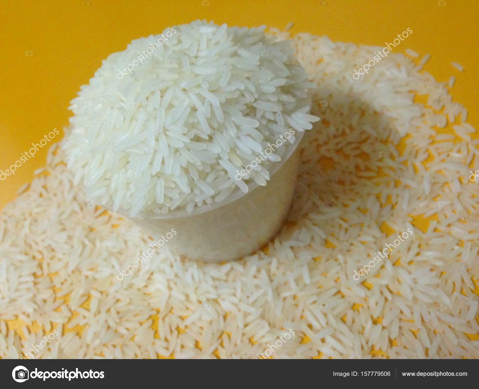 Rice basmati background — Stock Photo © LookTarnPhoto #157779506