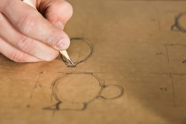 pottery, artisan tools, ceramics art concept - mans hand with pencil ...