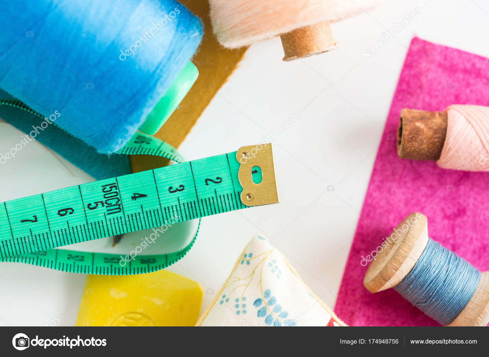 Sewing, patchwork and tailoring concept - closeup on measuring meter ...