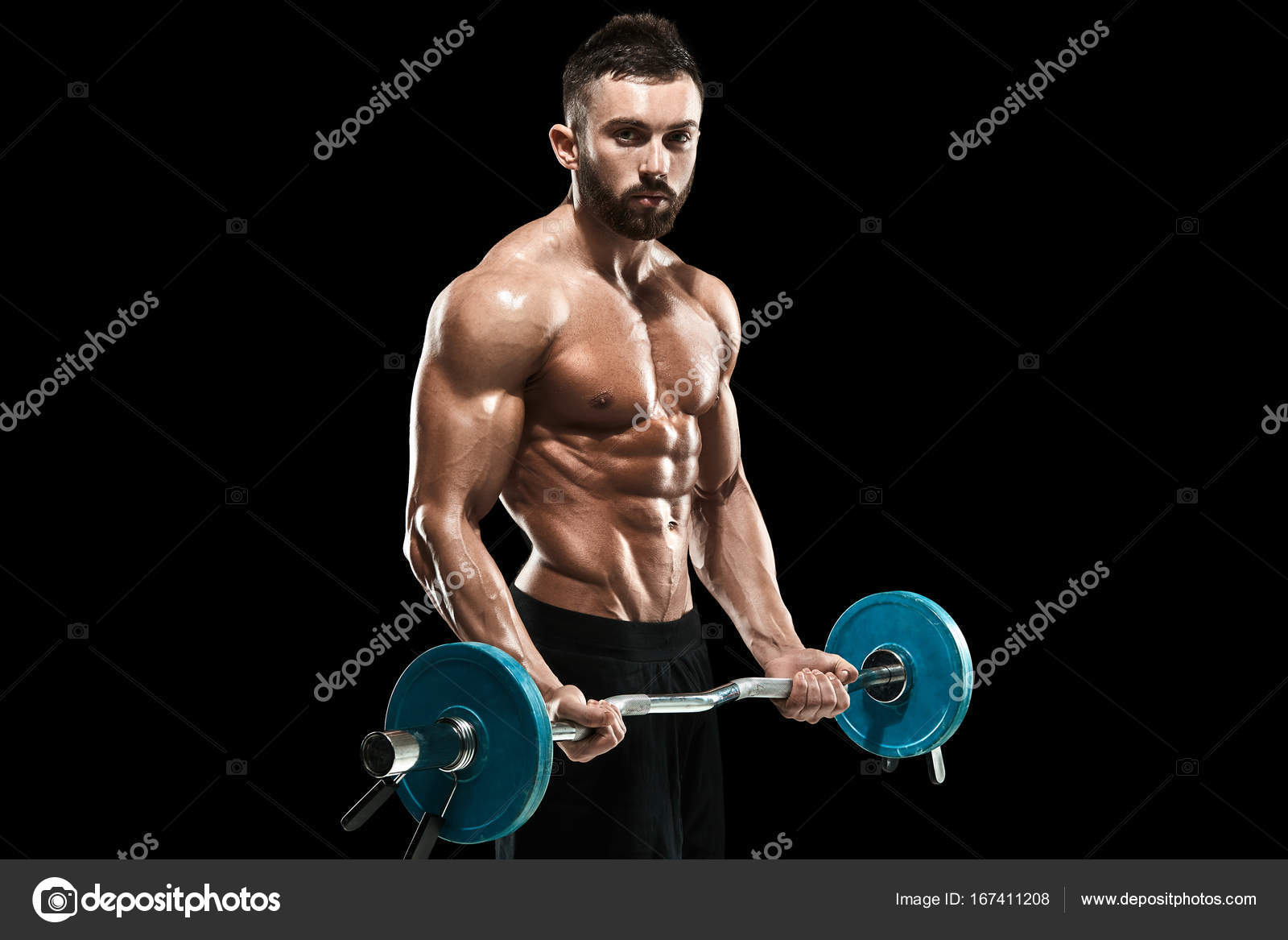 Muscular man lifting weights over dark background Stock Photo by ...