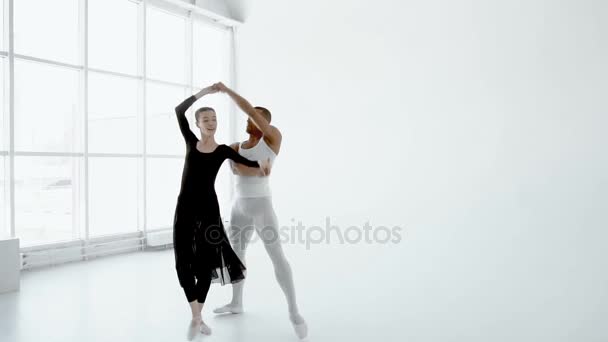 The ballet guy at ease raises and lowers the balerina slow motion ...