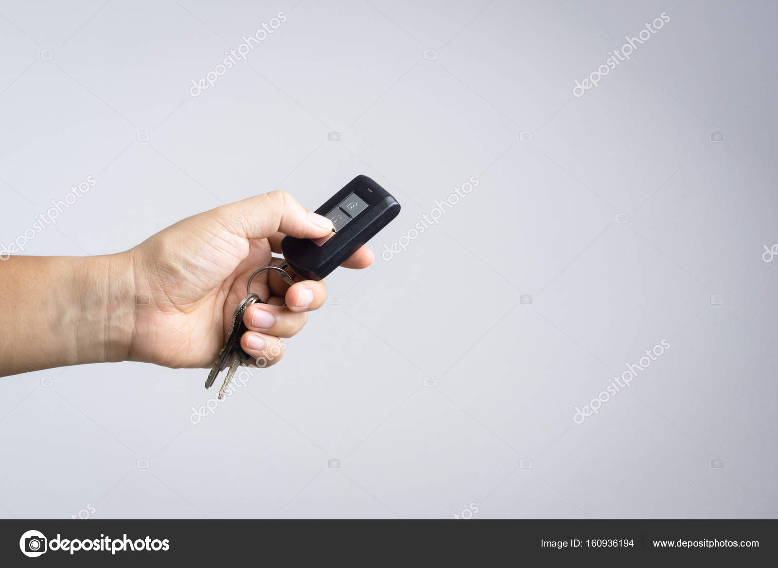 Hand holding and press car remote control Stock Photo by ©BonNontawat ...