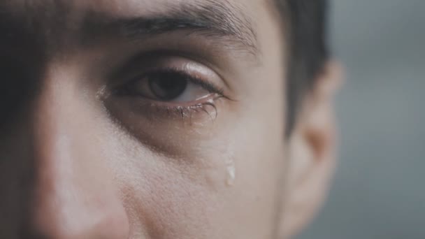 Close up of Crying man with tears in eye in slow motion — Stock Video ...