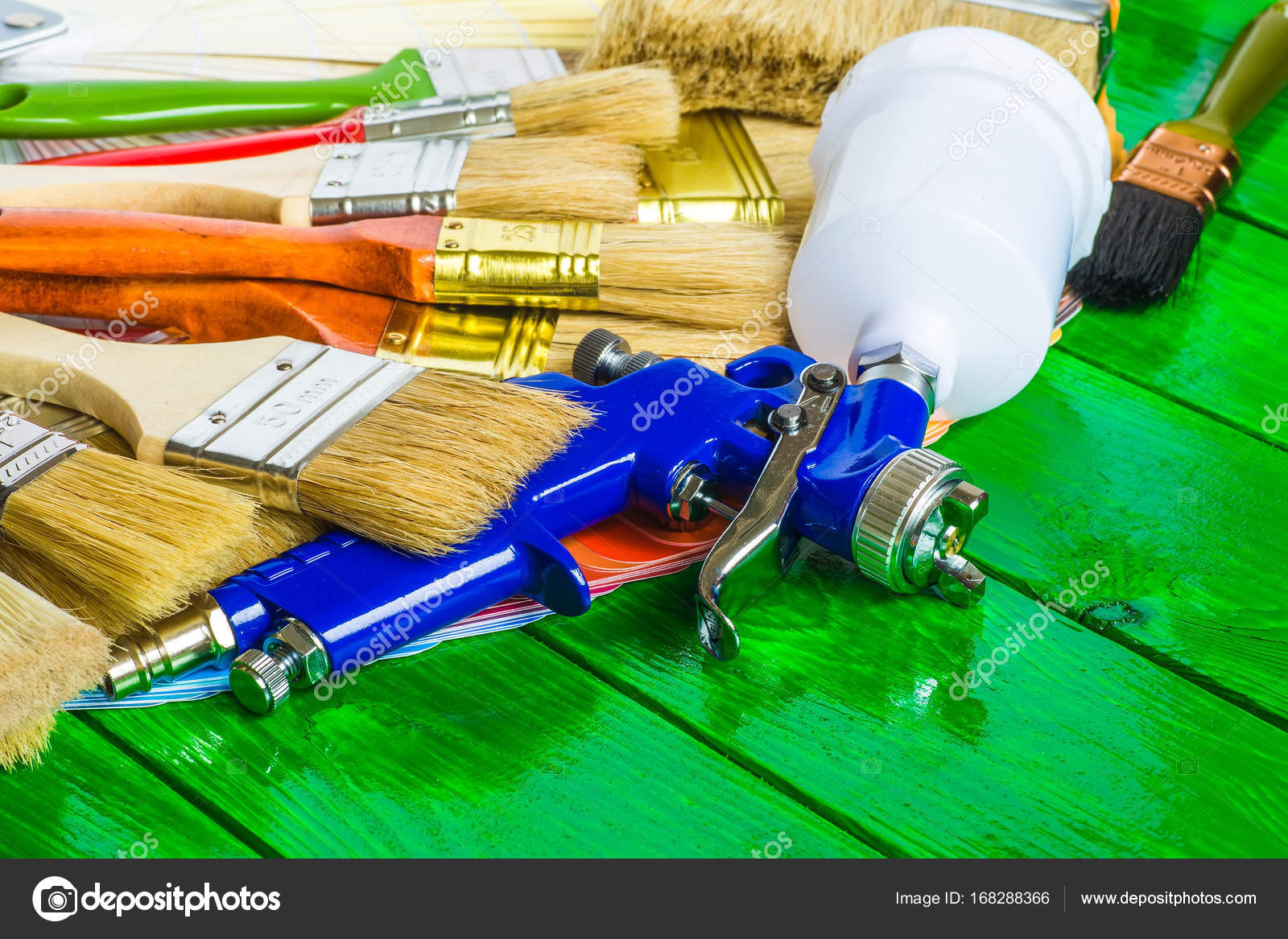 Painter and decorator work table with house project, color swatc ...