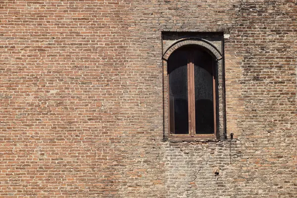 Castle window in a medieval style. Double arched window on a facade of ...