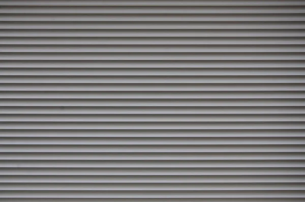 The texture of the shutter door or window in light gray color — Stock ...