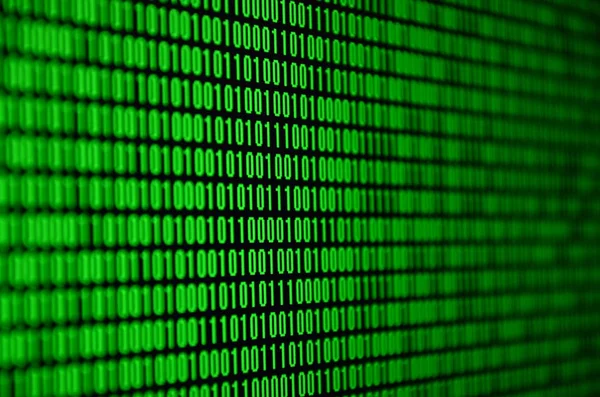 An image of a binary code made up of a set of green digits on a black background - Stock Image ...