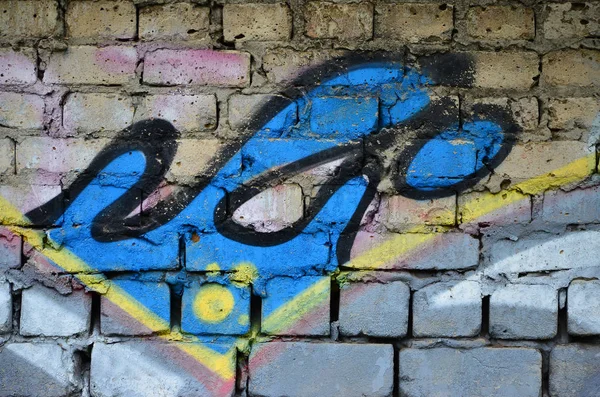 Detailed image of very old and aged color graffiti drawing on the wall ...