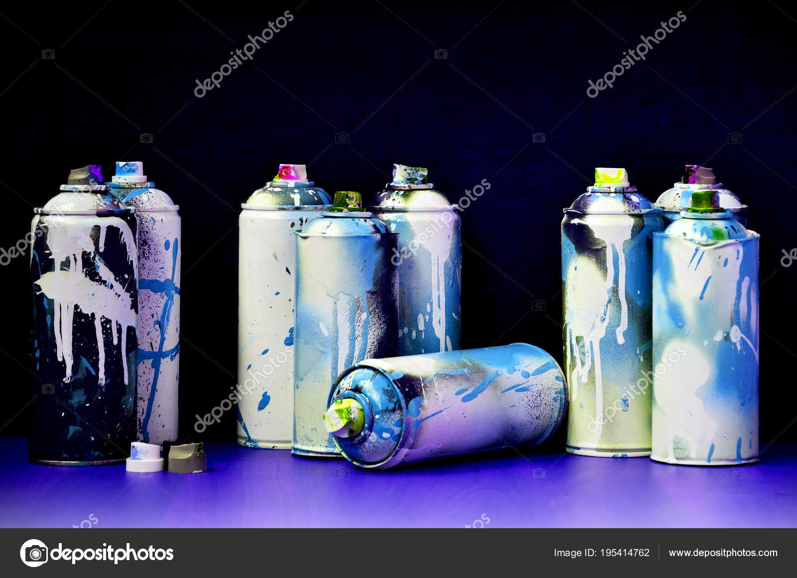 Still life with a large number of used colorful spray cans of aerosol ...