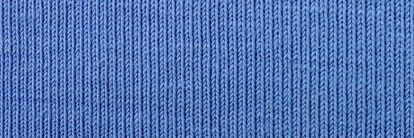 The texture of the fabric in blue color. Material for making shirts and ...