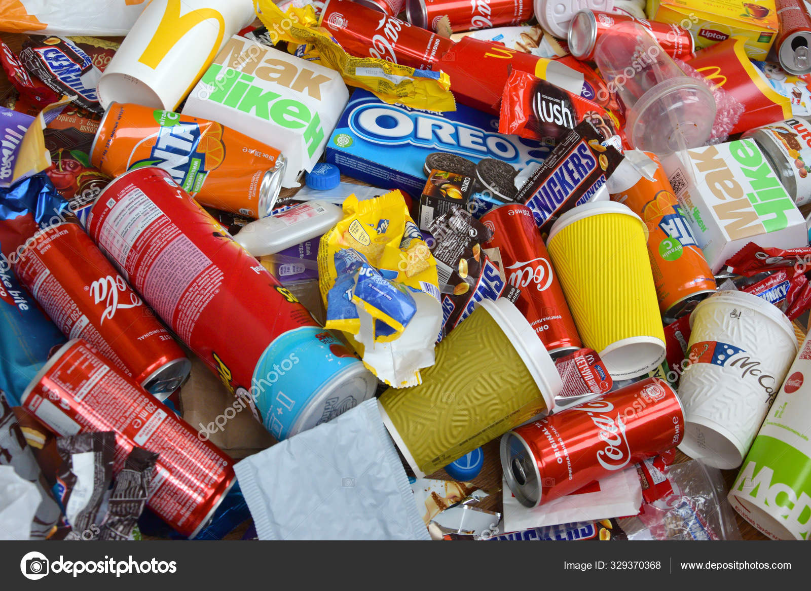 Big pile of many disposable colored trash from edible products of ...