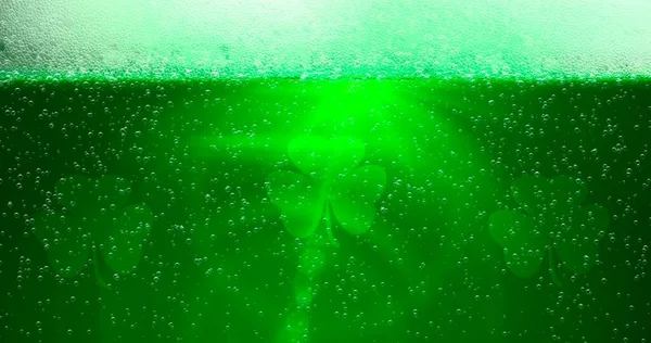 St. Patrick's Day Green Beer background with lens flare with shamrock ...