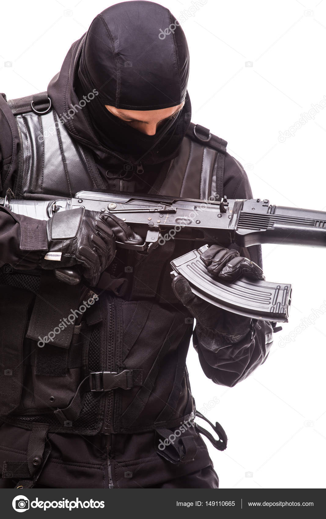 SWAT officer with assault rifle in black uniform isolated on white ...