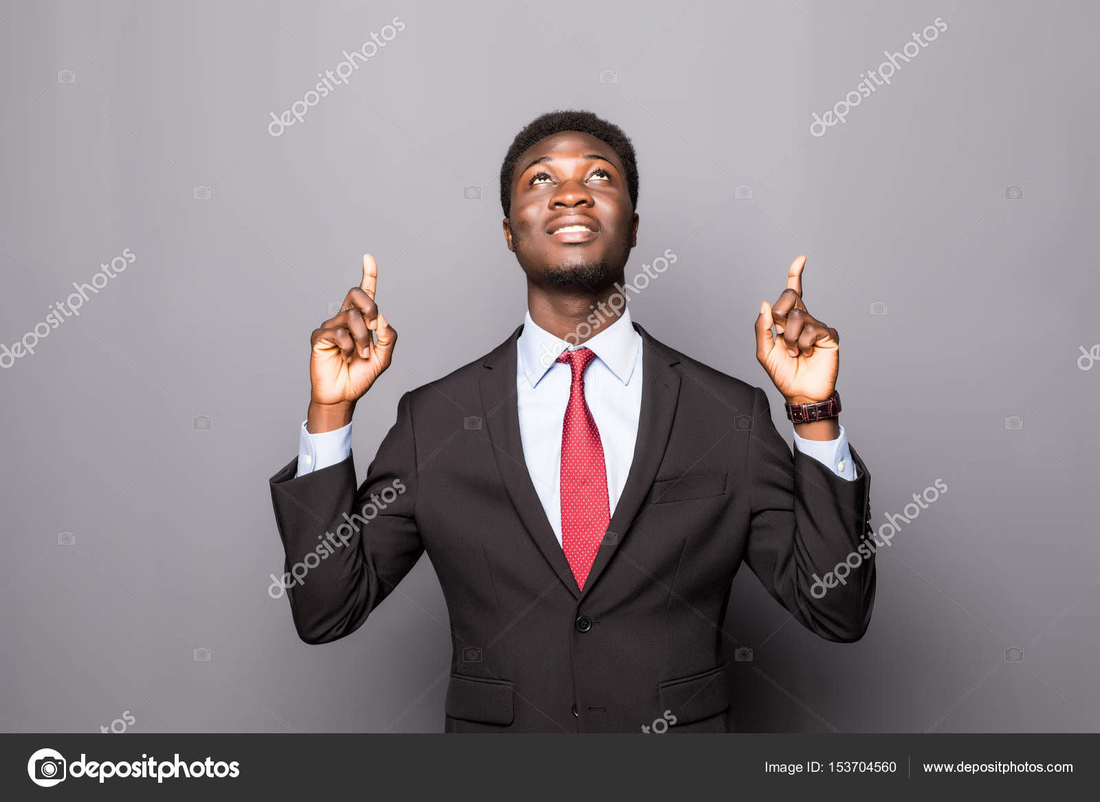 Black business man pointing up isolated over white Stock Photo by ©dan ...