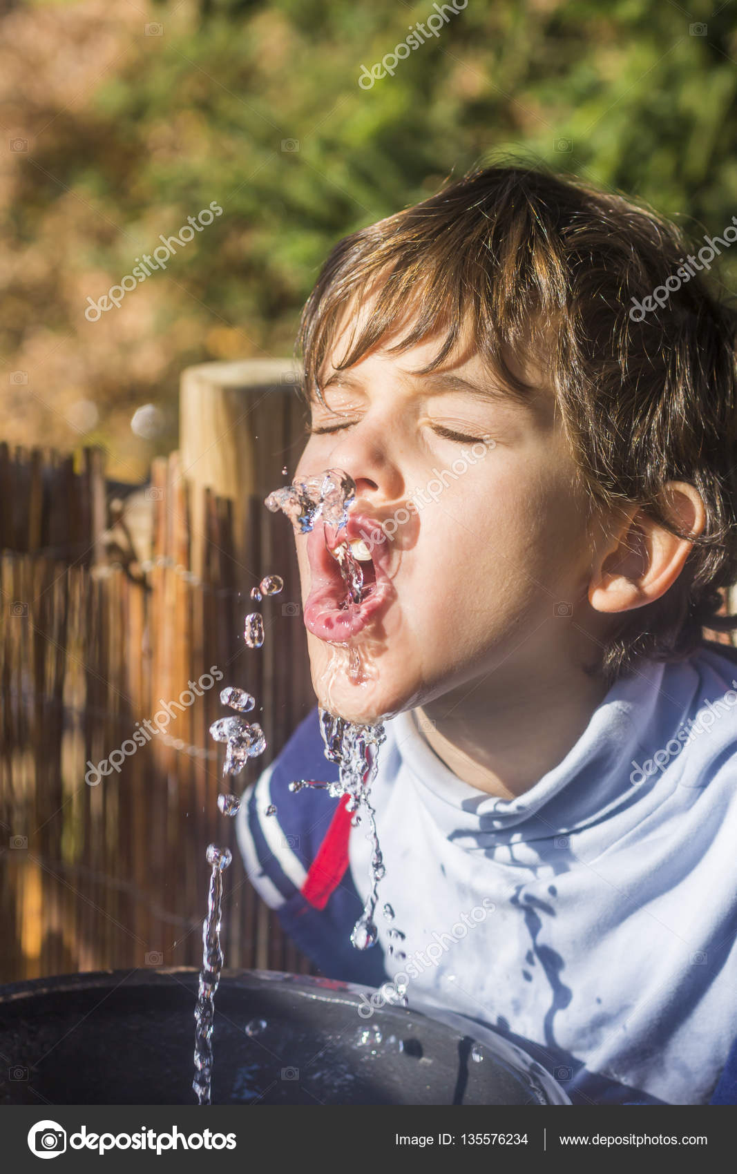 Kid Drinking Water From Fountain