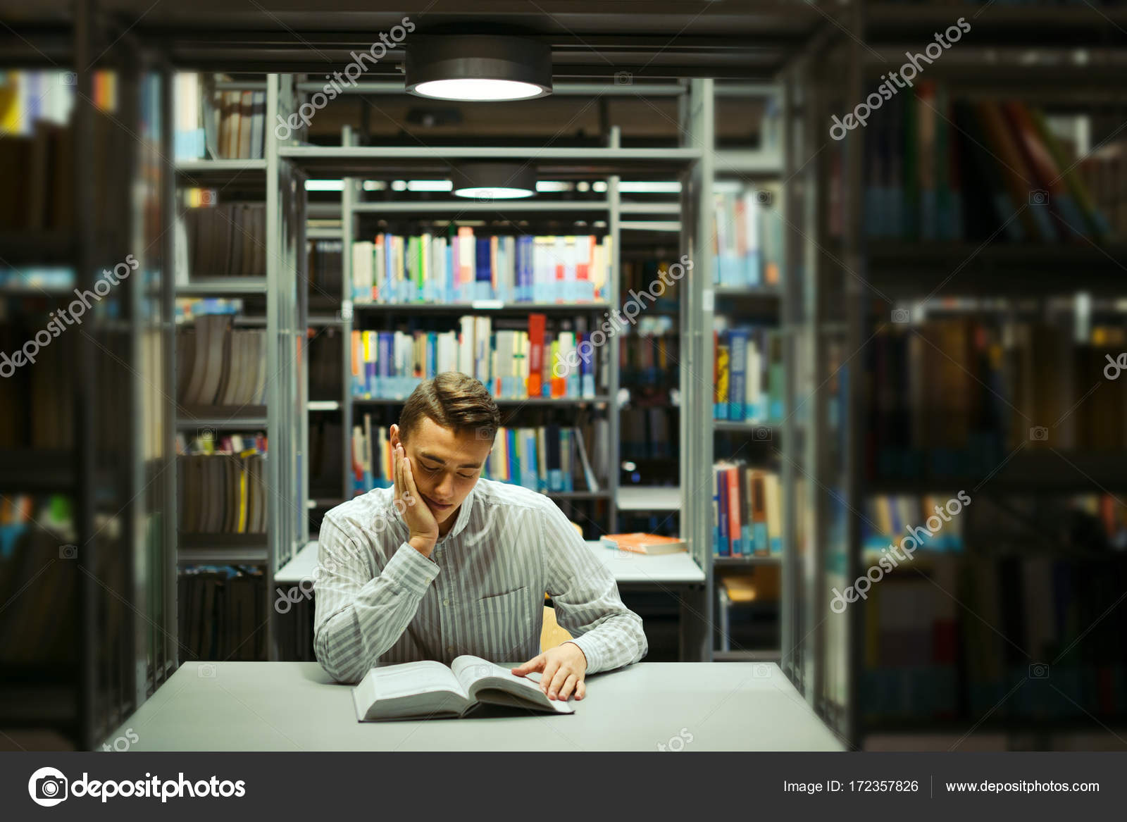 Man sit on the library and read book with blur background — Stock Photo ...