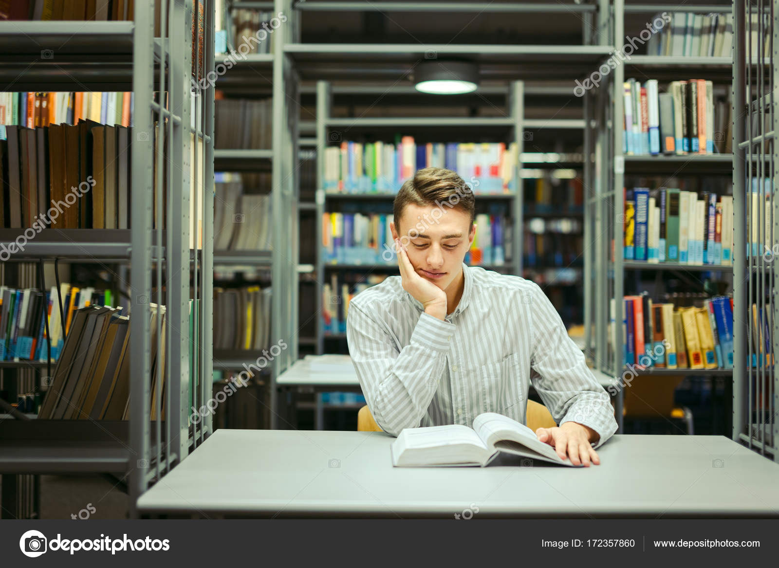 Person Reading A Book In Library