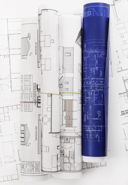 Architecture blueprints on table Stock Photo by ©belchonock 113531588