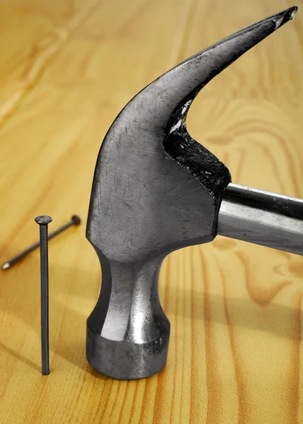 A hammer hitting a nail Stock Photo by ©milosluz 5754386