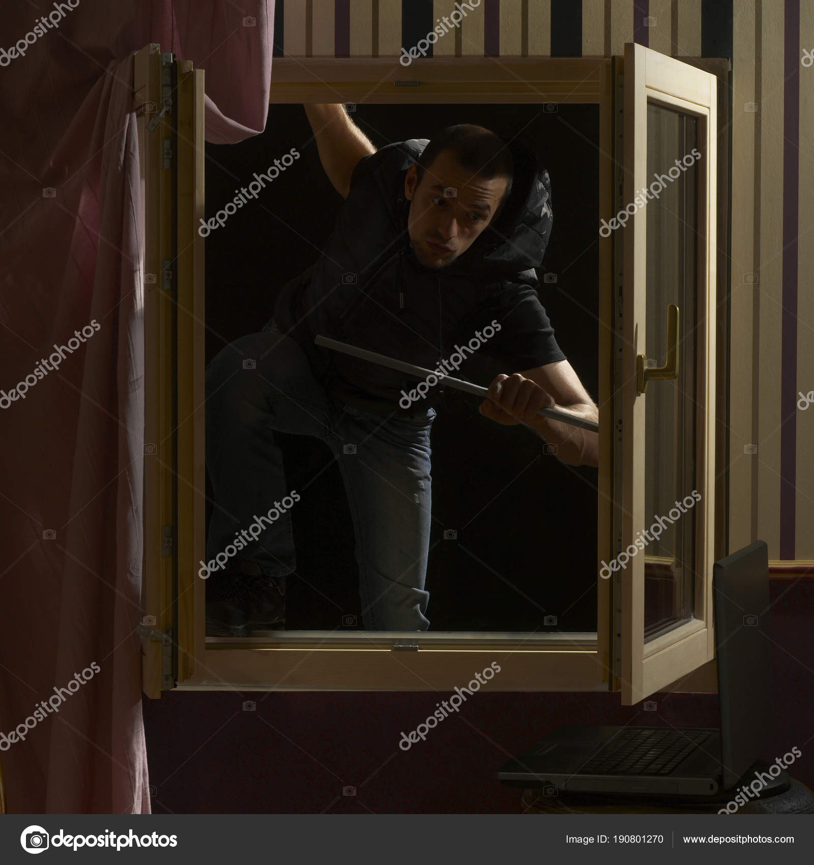 Man Breaking House Window — Stock Photo © Goir #190801270