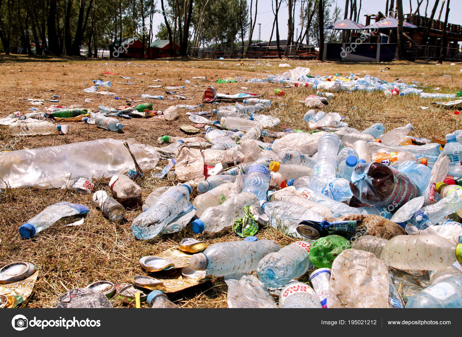 Plastic pet bottles left on grass after an party, event. Used empty ...