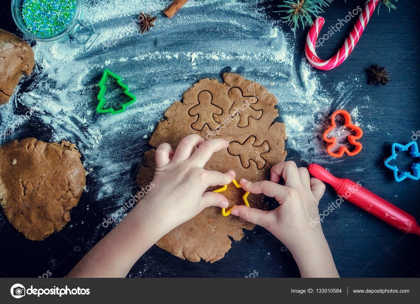 Little girl making Christmas cookies — Stock Photo © NelliSyr #133010584